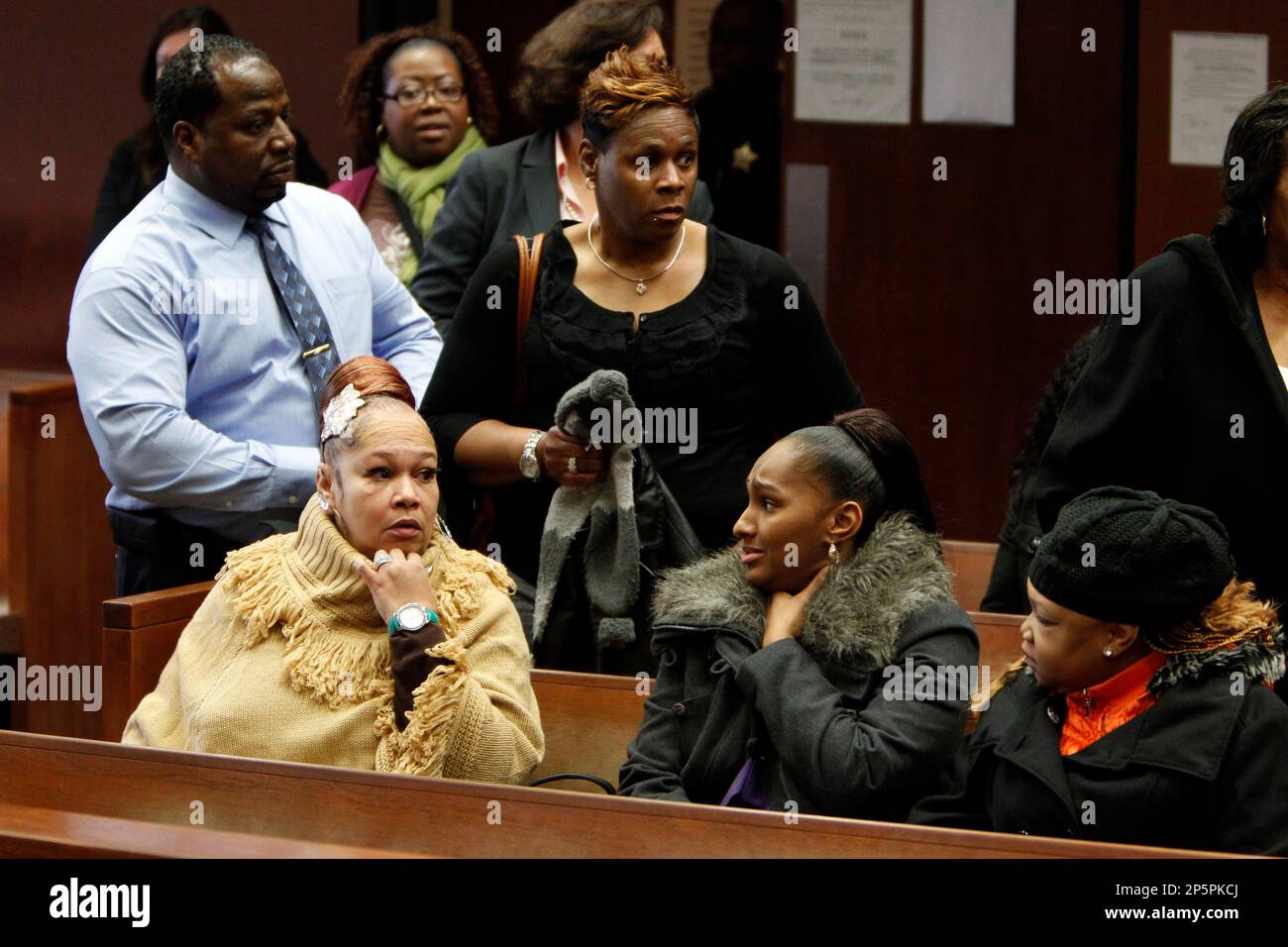 Shalga Hightower, mother of murder victim Iofemi Hightower, seated left ...