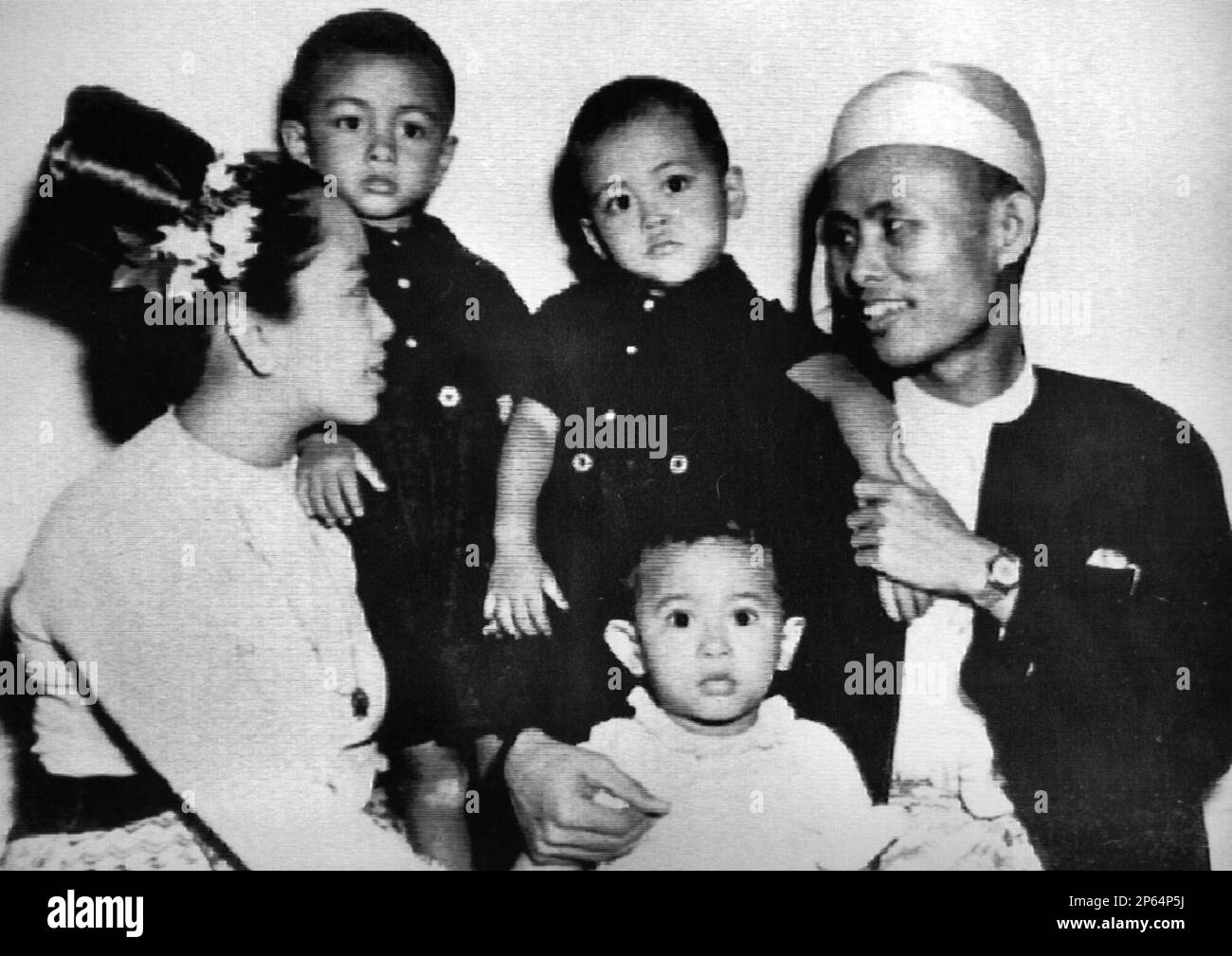 FILE - In this 1947 file photo, 2-year-old Aung San Suu Kyi, center ...