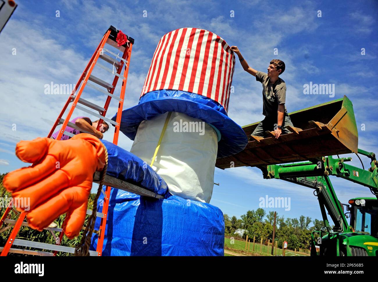 Necole Halsey, left, and Isaac Fulks of Belvedere Plantation use a ...