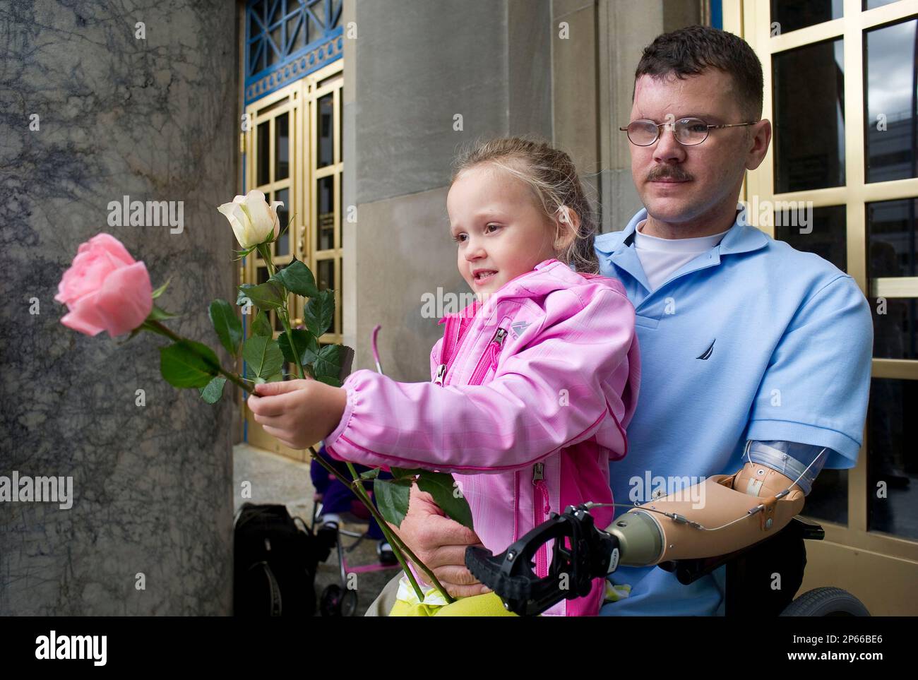 U.S. Marine Corps Staff Sgt. Thomas McRae sits outside the Alaska State ...