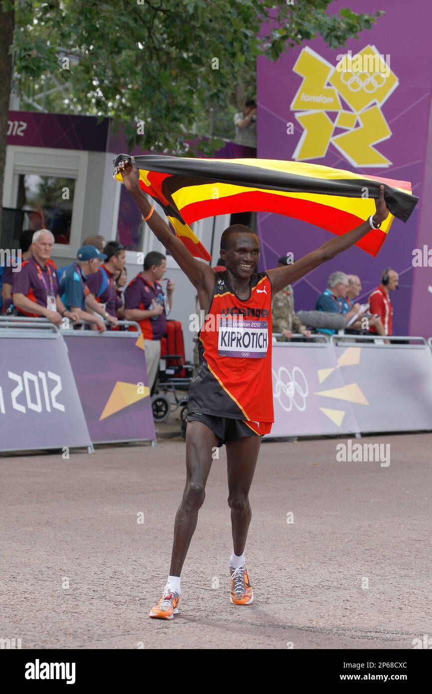 Uganda's Stephen Kiprotich celebrates winning the gold medal in the men ...