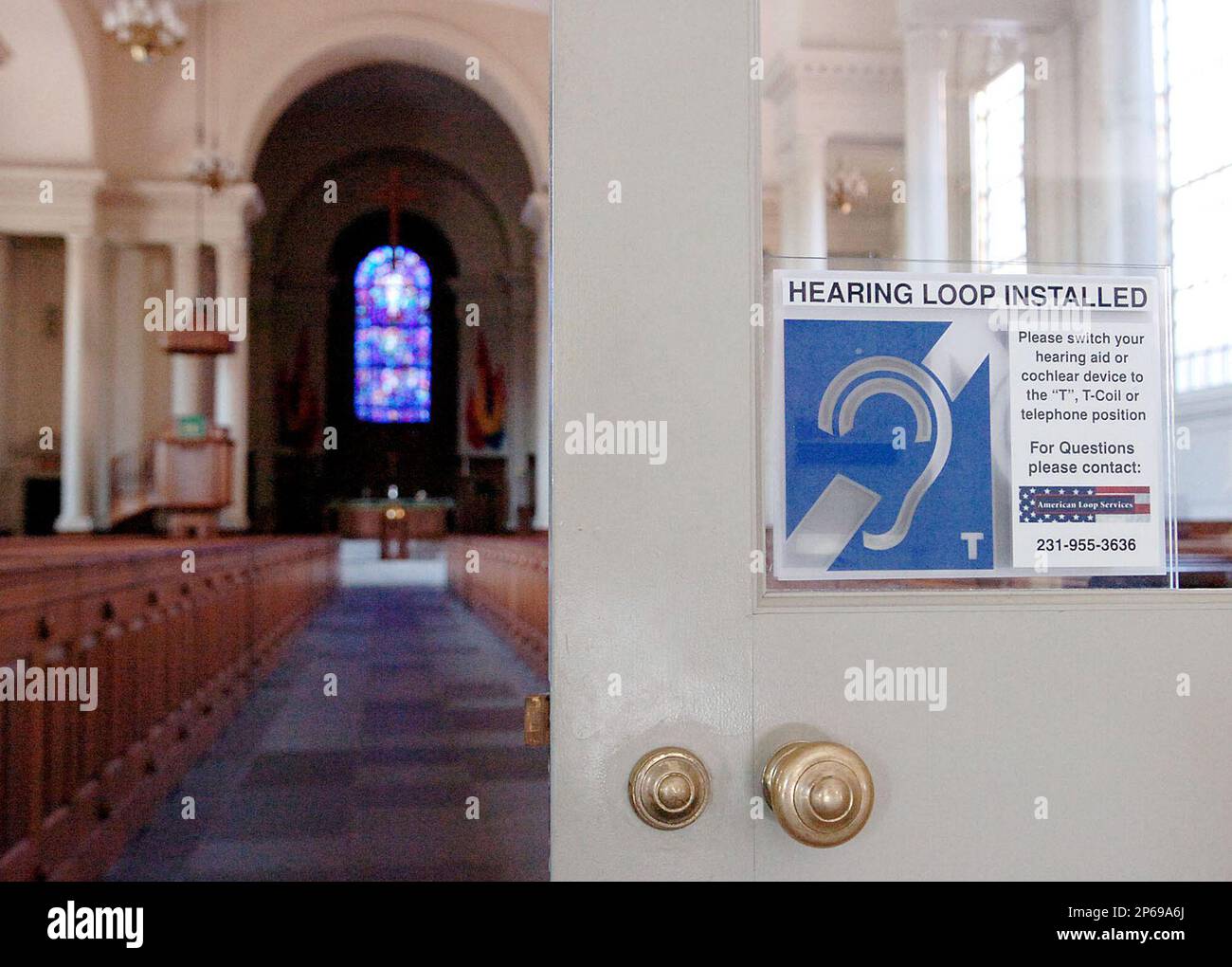 The sign for a hearing loop system is shown in this July 12, 2012 video ...