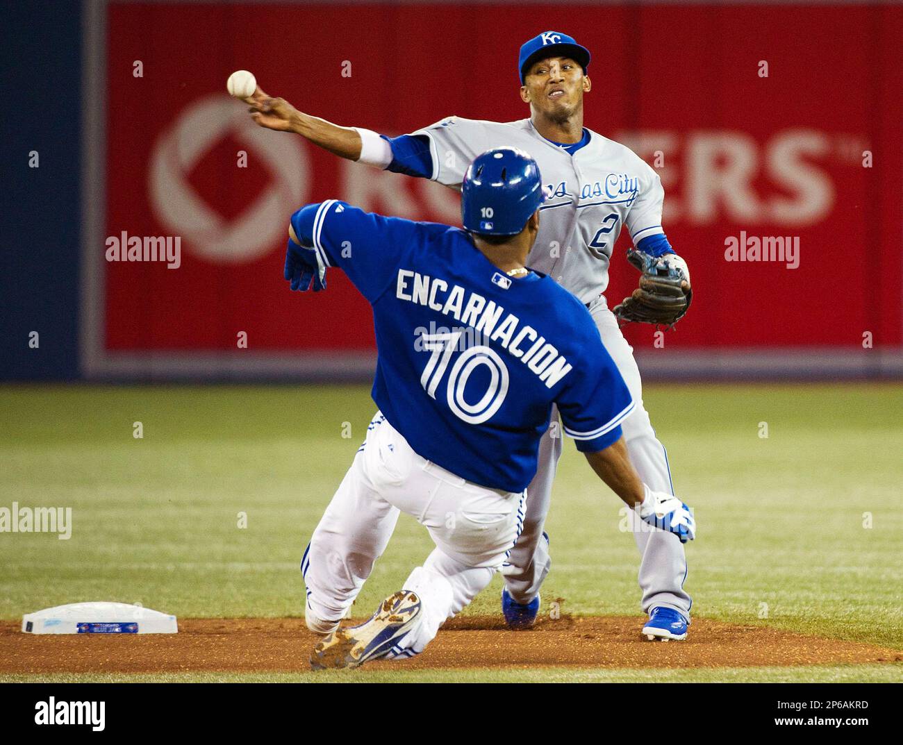 Kansas City Royals shortstop Alcides Escobar, top, forces out Toronto ...