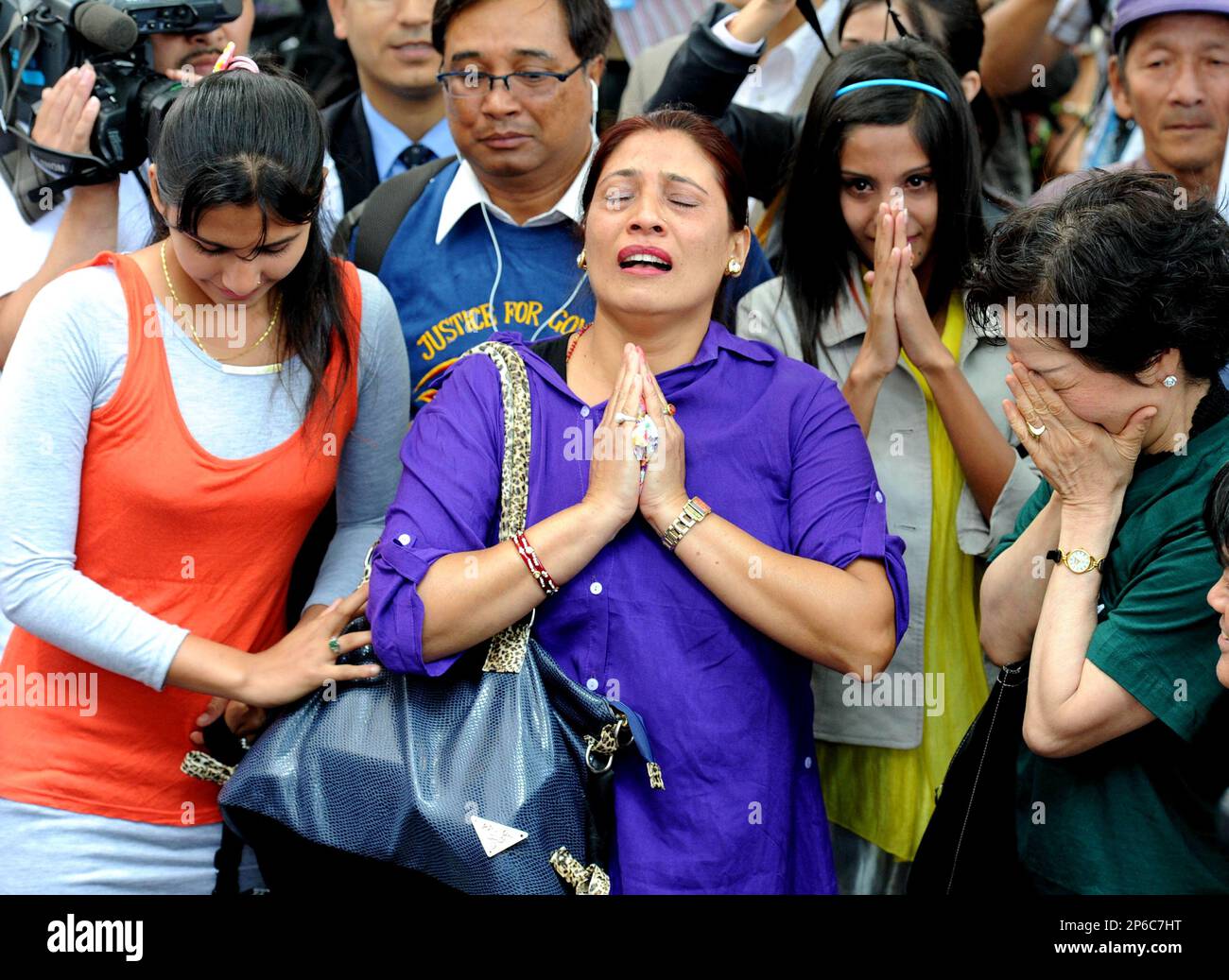 Radha 42,(C) , Govinda Prasad Mainali's wife, her younger daughter ...