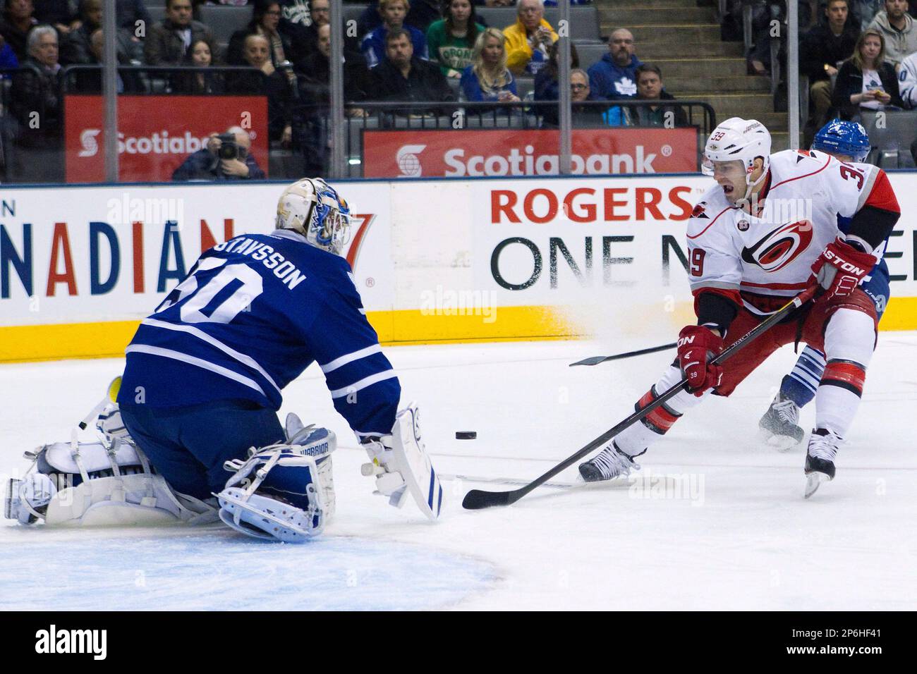 Toronto Maple Leafs goaltender Jonas Gustavsson, left, stops Carolina ...