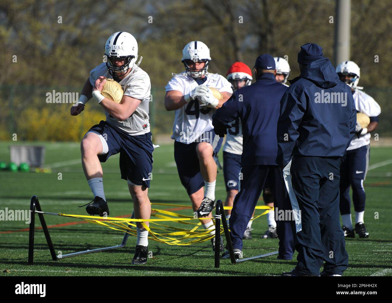 Penn State running back Zach Zwinak, left, runs a drill during the ...