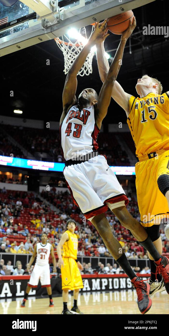 2012 MAR 08: UNLV's Mike Moser (43) against Wyoming's Adam Waddell (15 ...
