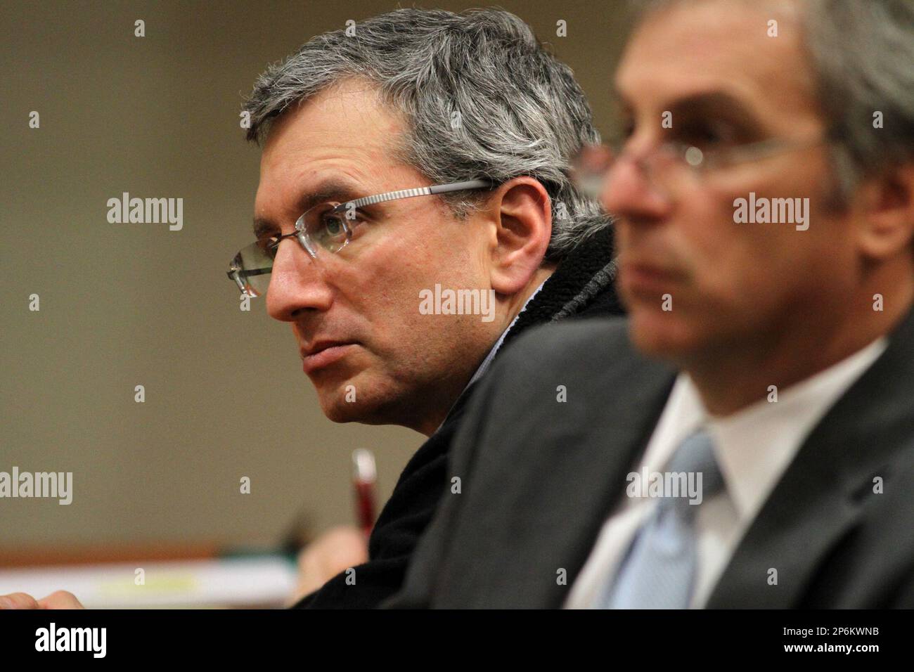 Hemy Neuman listens as Andrea Sneiderman testifies during day one of ...