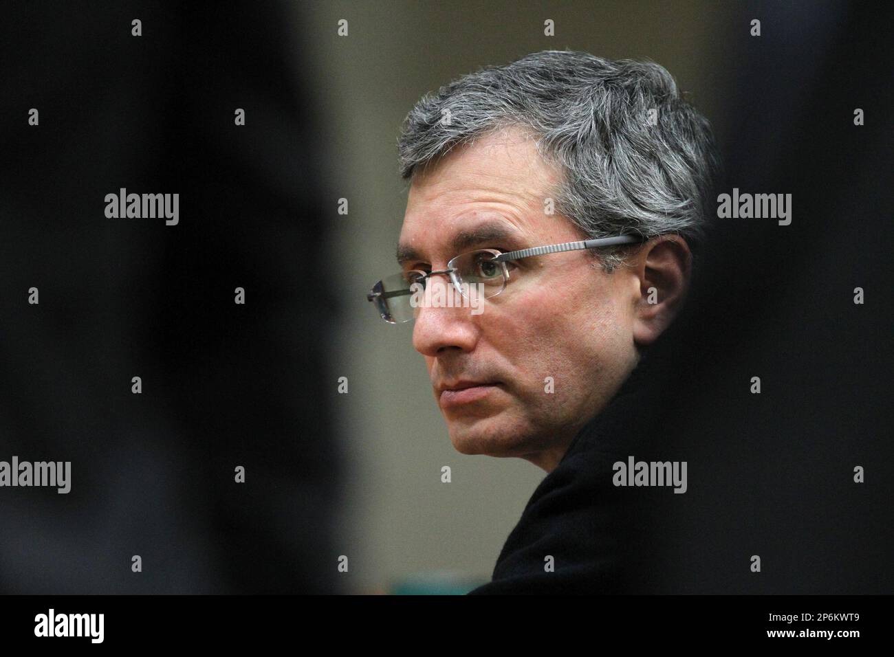 Hemy Neuman listens as Andrea Sneiderman testifies during day one of ...