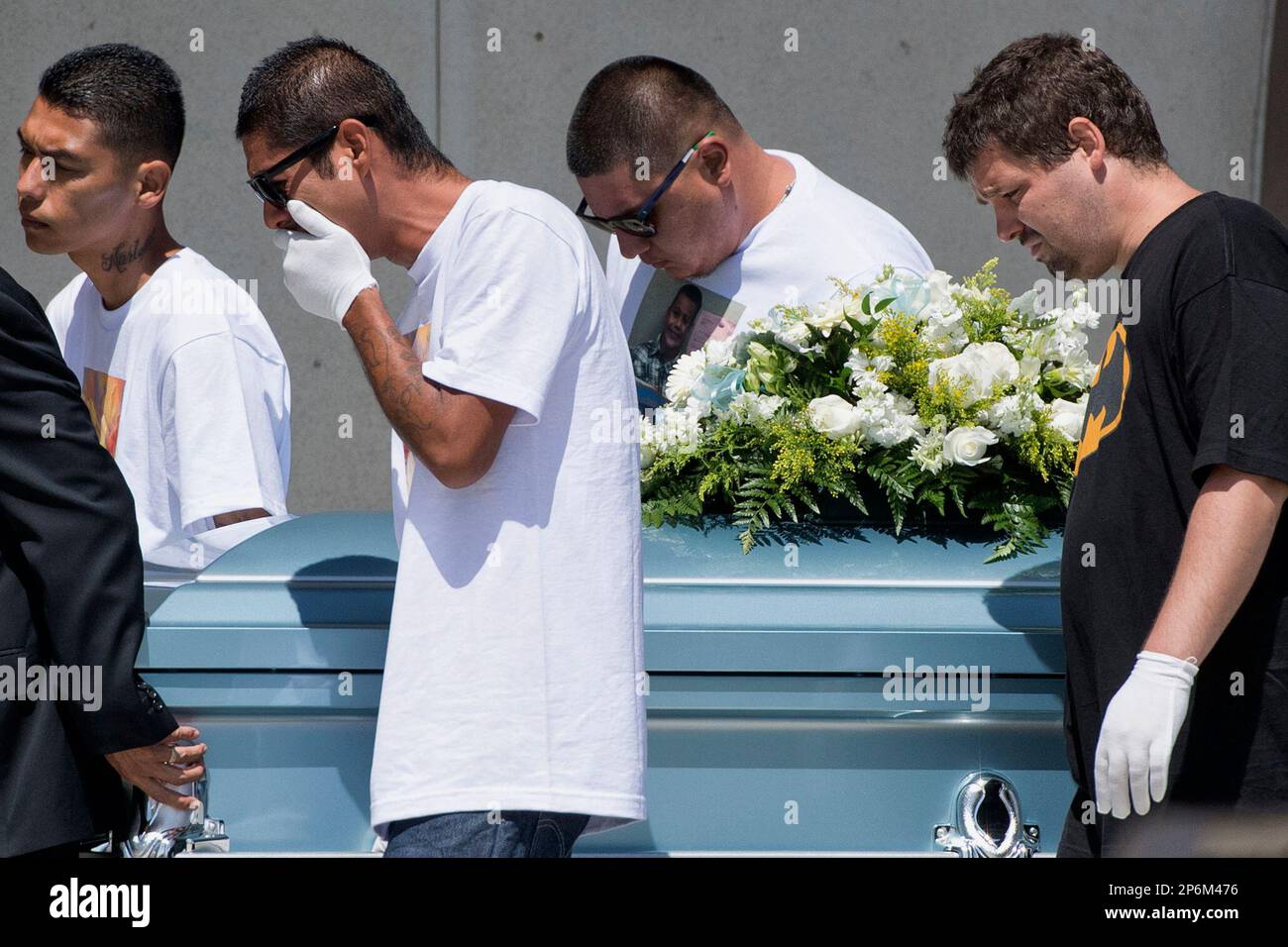 FILE - Victor Avalos, the father of Anthony Avalos, carries his son's ...