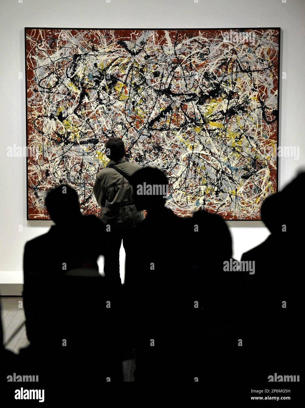 Visitors admire a Jackson Pollock's masterpiece “Mural on Indian Red ...