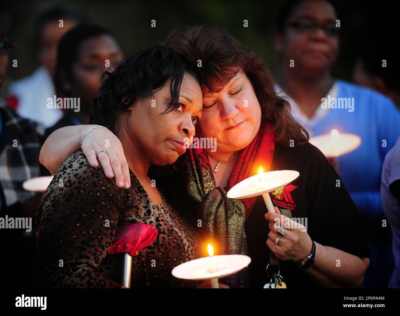Valorie Brown Renee Gade embrace during a vigil for Aiken Public Safety ...