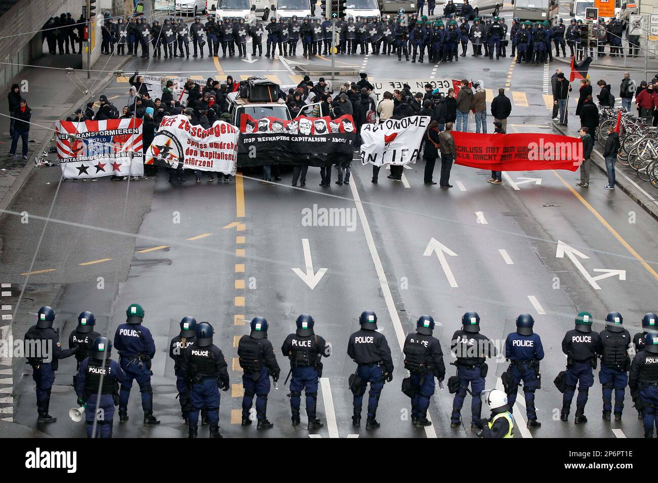 A group of protesters is surrounded by riot police during a anti World ...