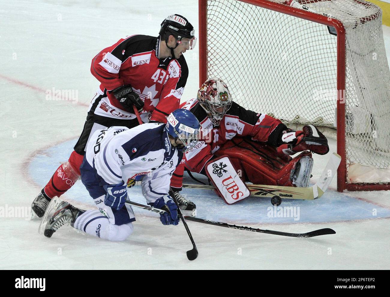 Canada's goalkeeper Marty Turco, right, and his teammate Derrick Walser ...