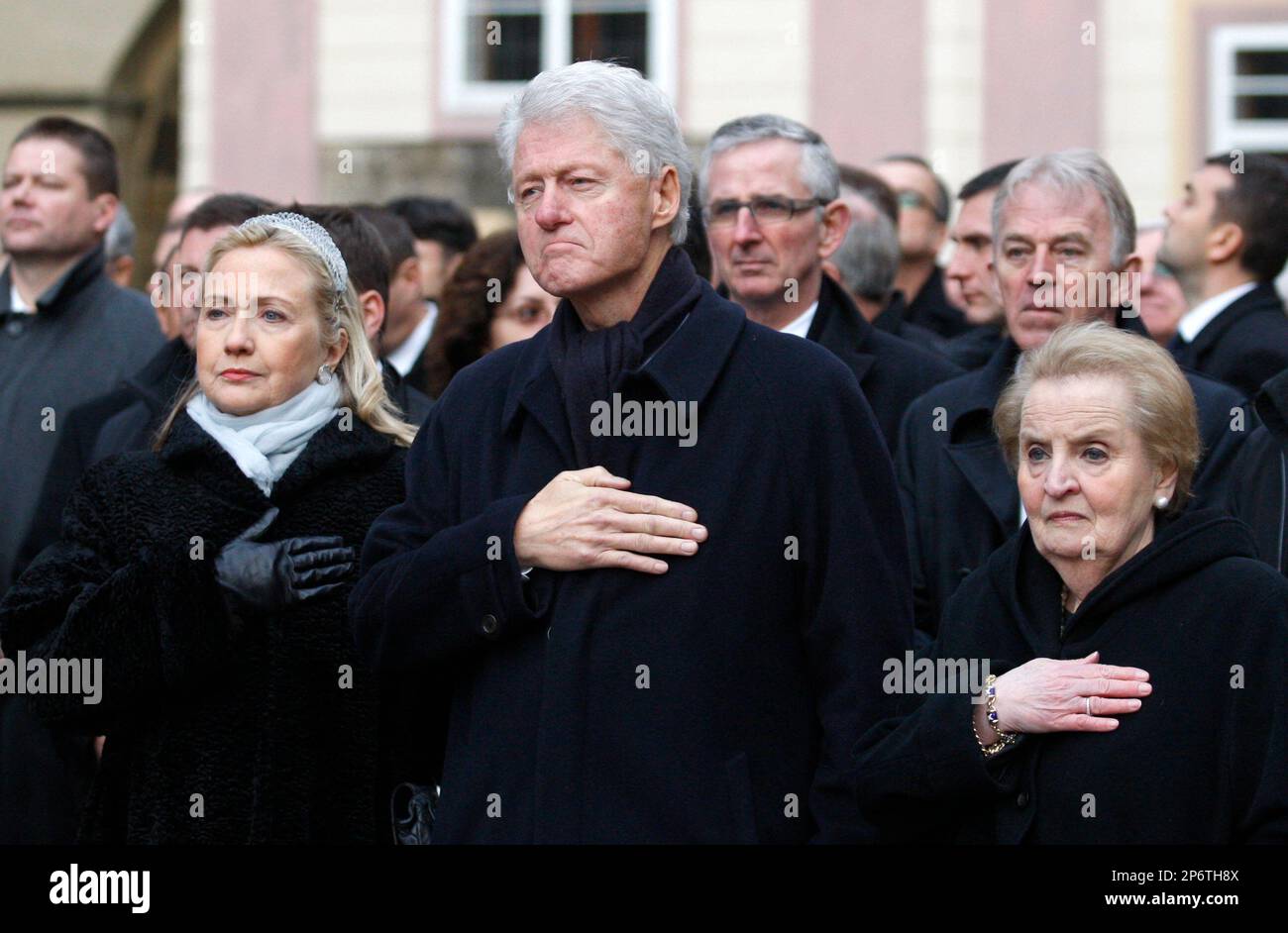 Former US President Bill Clinton, center is flanked by his wif, US ...