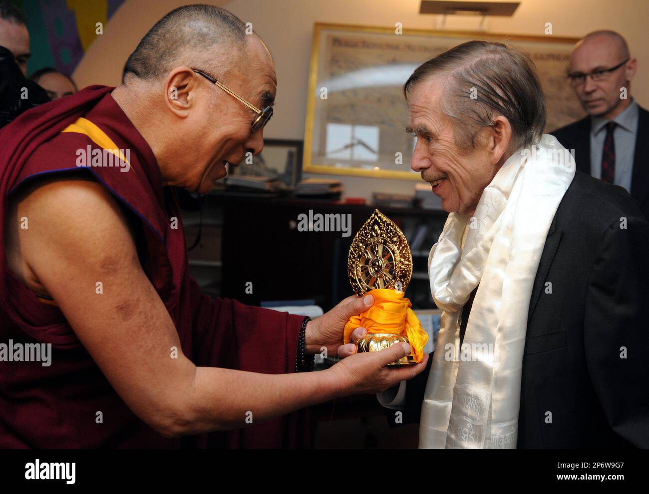 Tibetan spiritual leader the Dalai Lama, left, hands a present to Czech ...