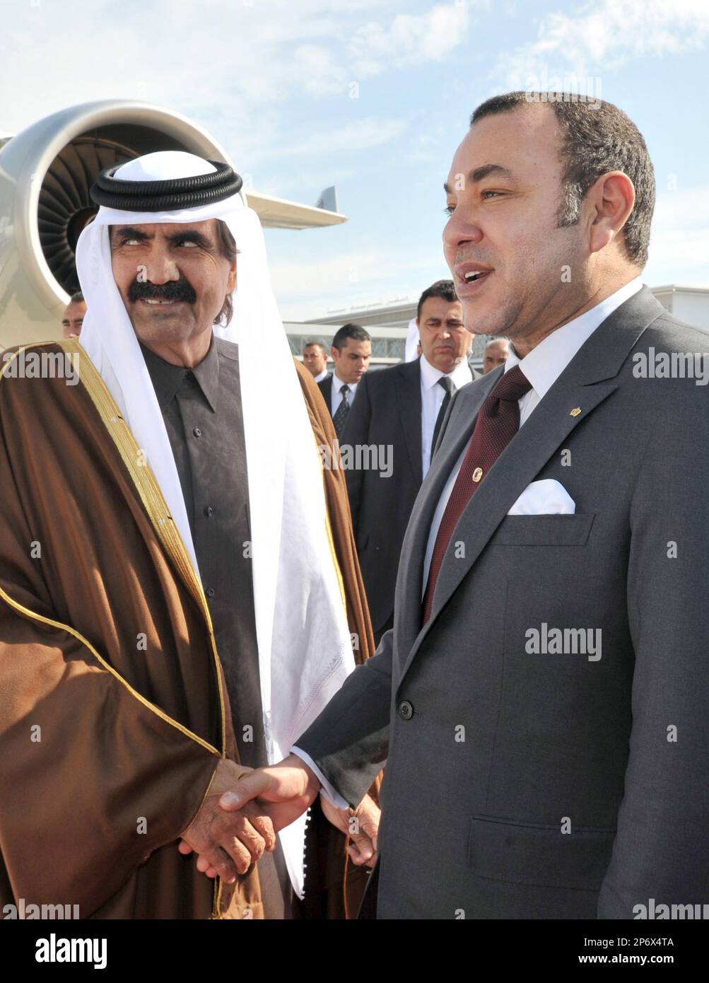 In this photo released by the Moroccan Royal Palace Morocco's King Mohammed VI, right, shakes ...