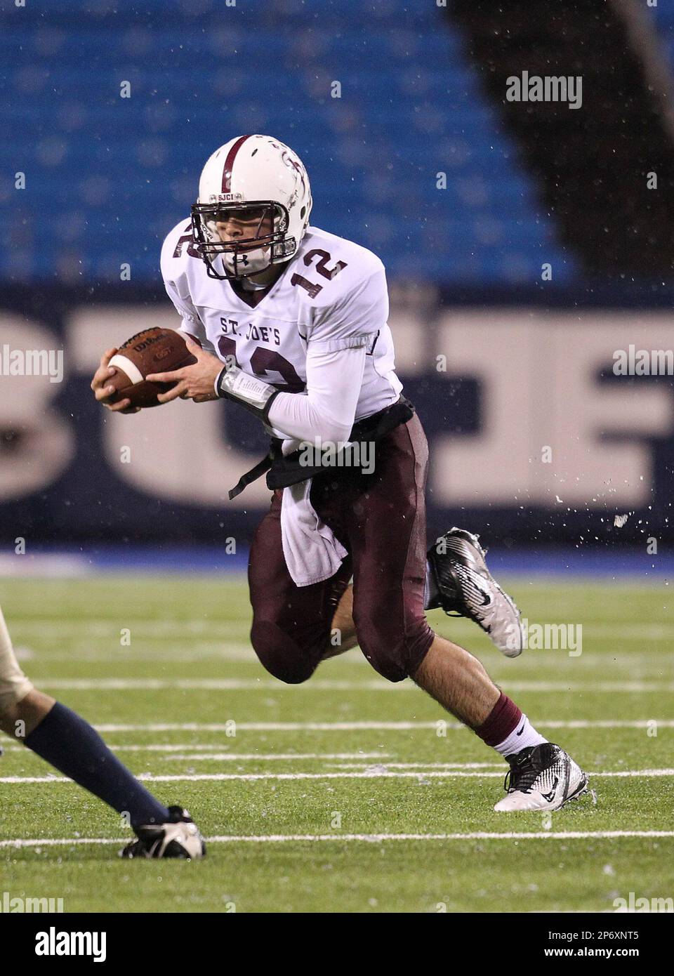 St. Joeseph's Collegiate Institute quarterback Chad Kelly #12 scrambles ...