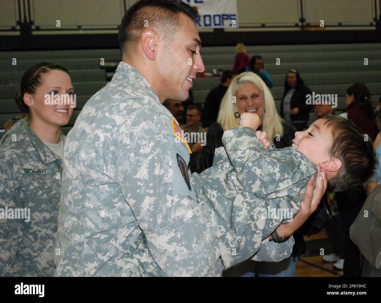 Pvt. Alonso Giuchin, of Ishpeming, Mich., plays with his 4-year-old son ...