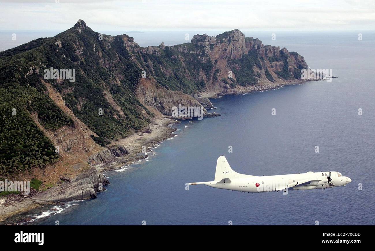 A patrol aircraft P3C of Japan Maritime Self Defense Force (JMSDF ) flies over Uotsuri Jima, one ...