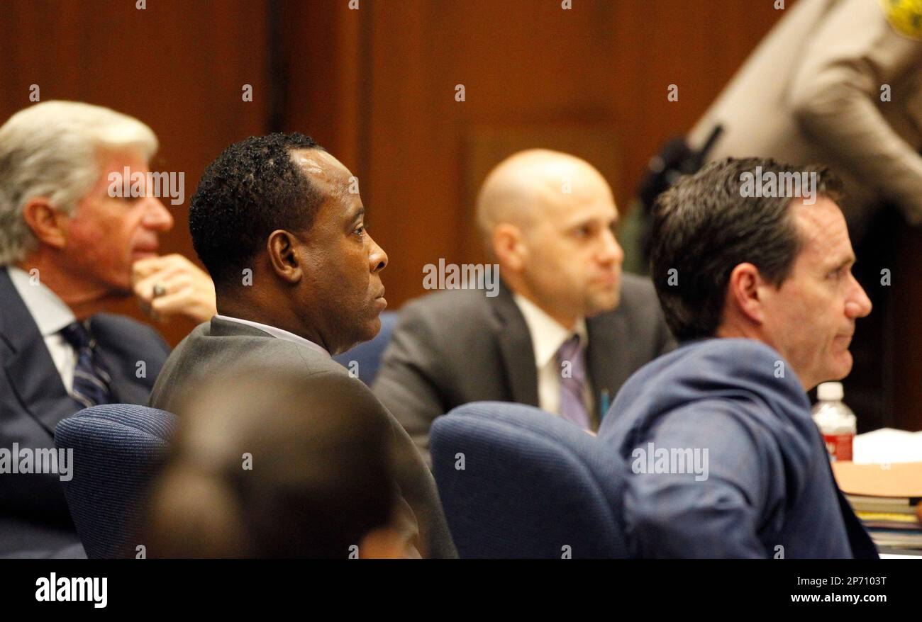 Dr. Conrad Murray, second left, sits at the defense table with his ...