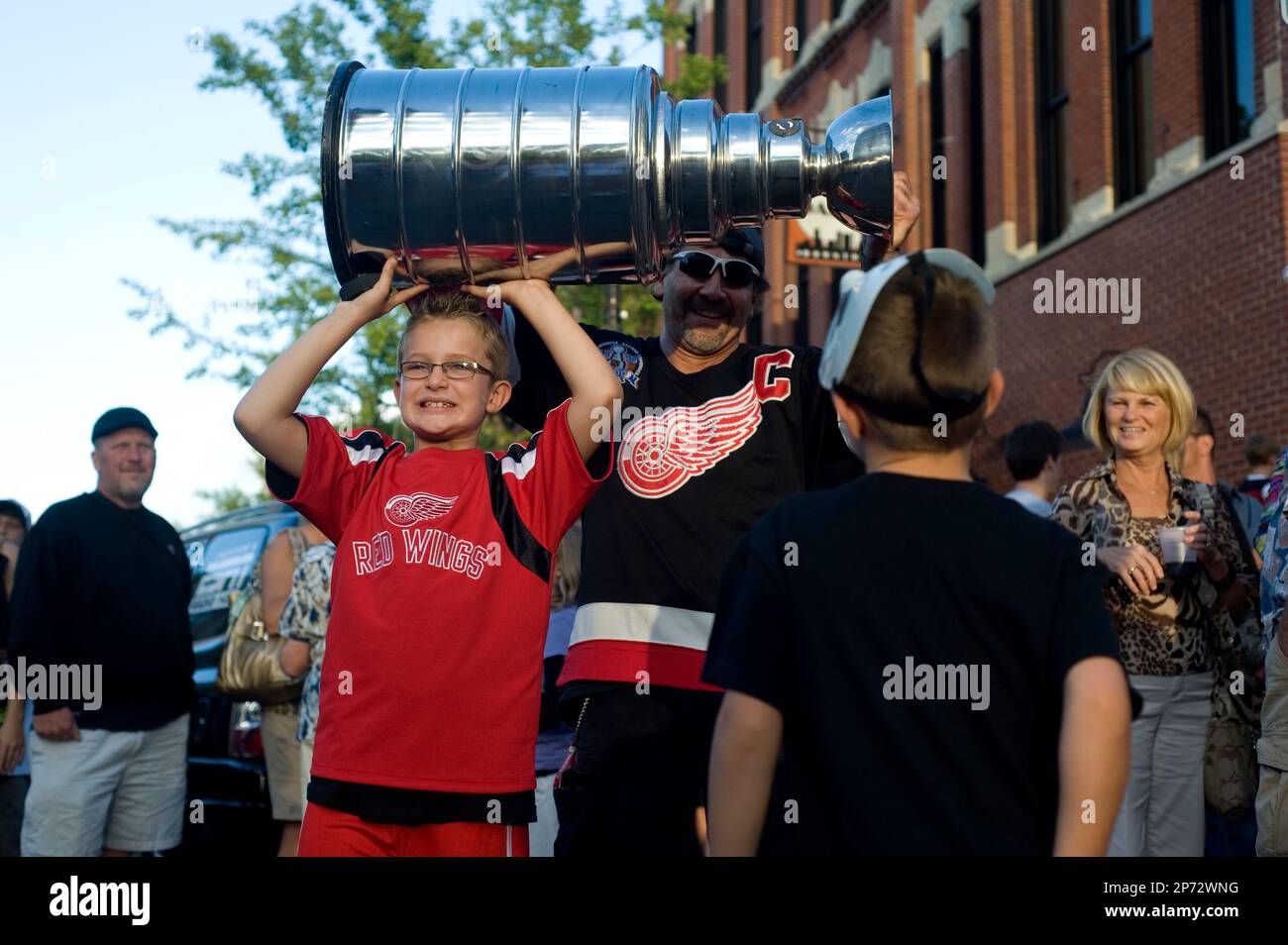 Michael Nau, 8, poses for a photo with Mark Hetherington's replica ...