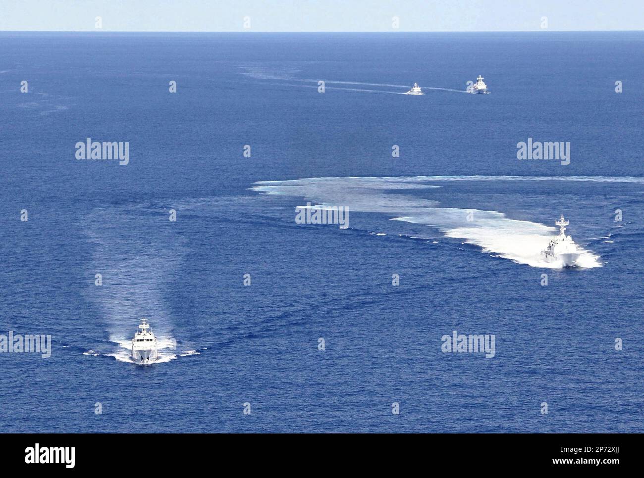 An aerial picture from Yomiuri jetliner shows Japan Coast Guard patrol ...