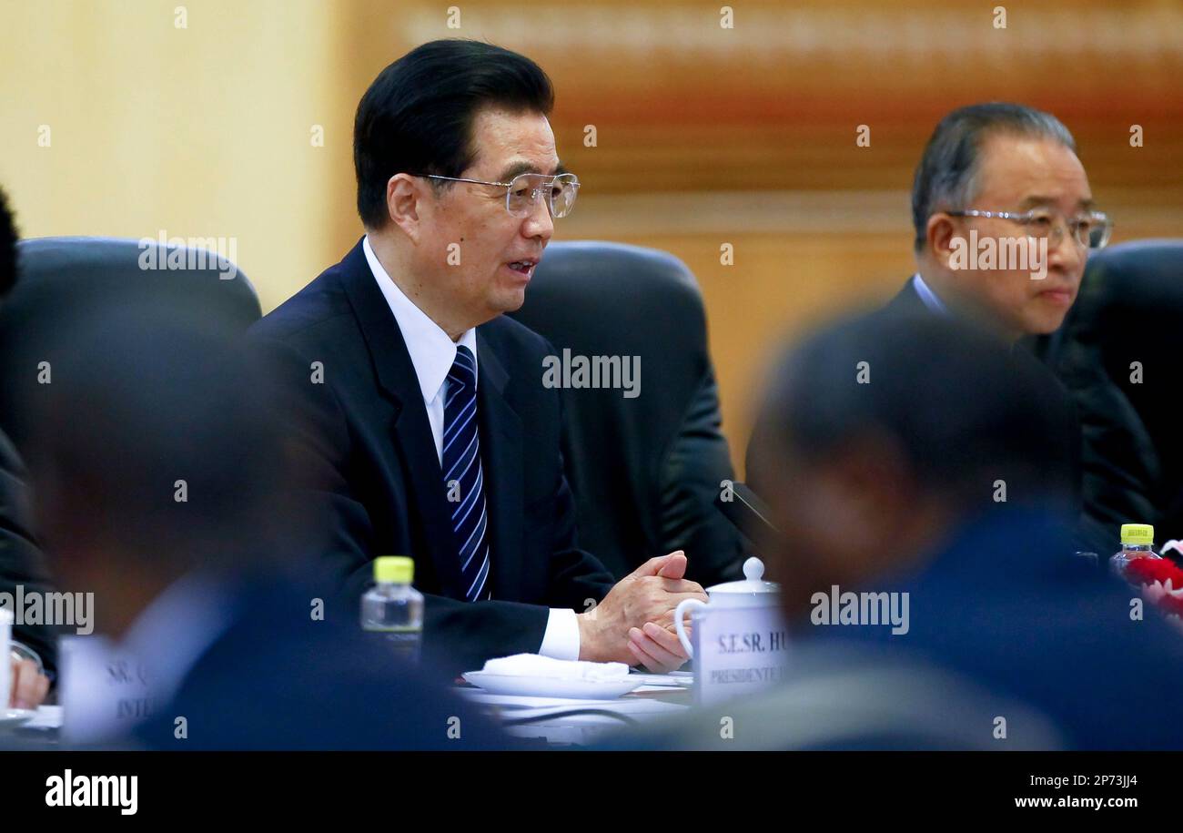 Chinese President Hu Jintao, left, addresses his Mozambique counterpart ...