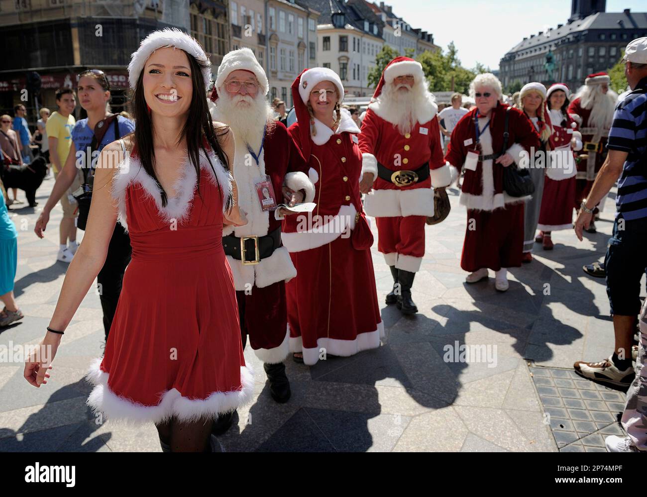 Men and women dressed as Santa Klaus take part in a street parade in ...