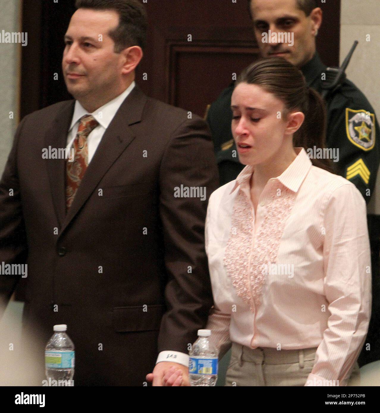 Casey Anthony holds hands with her defense attorney Jose Baez as they ...