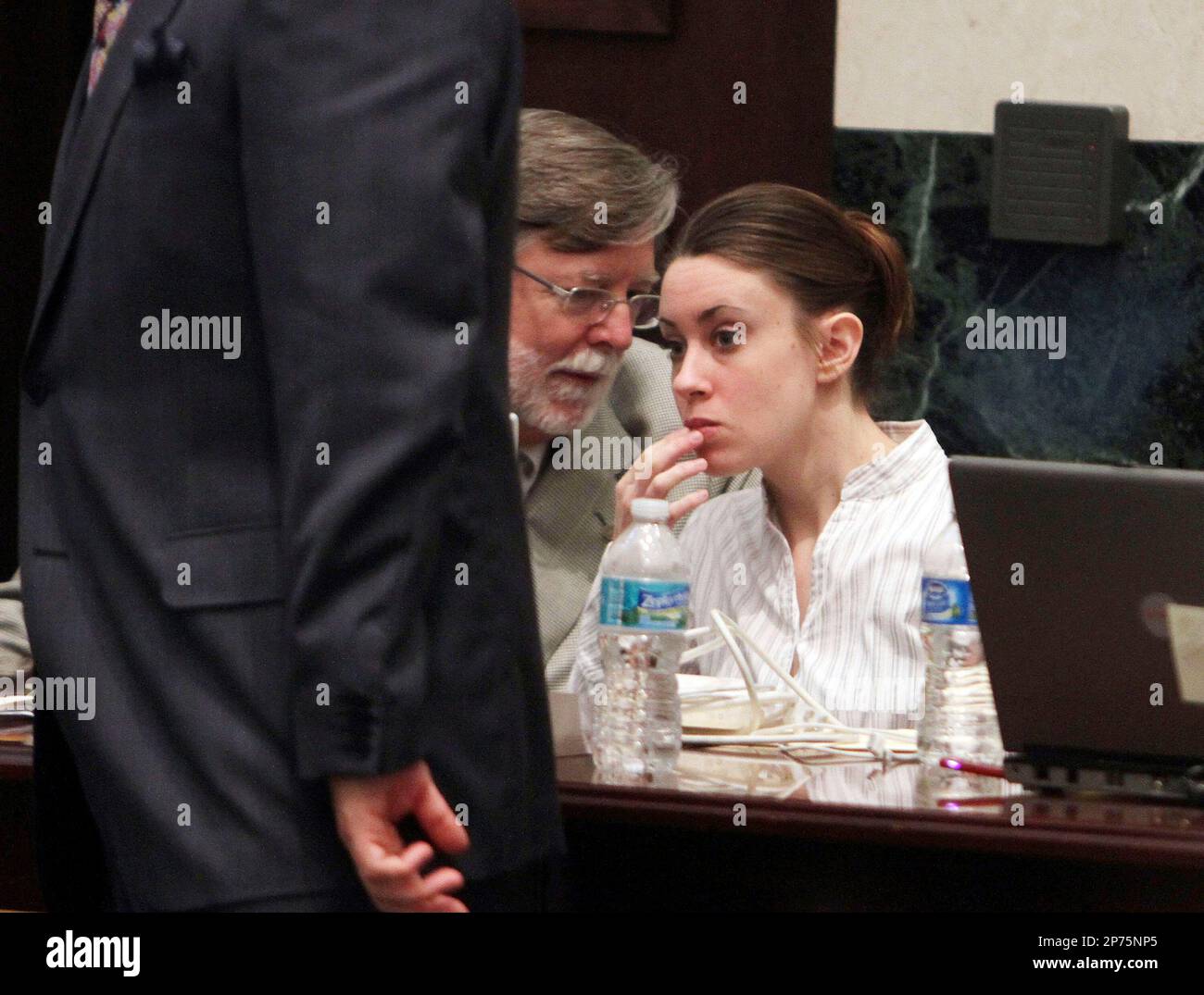 Attorney Cheney Mason, left, confers with Casey Anthony as a witness ...