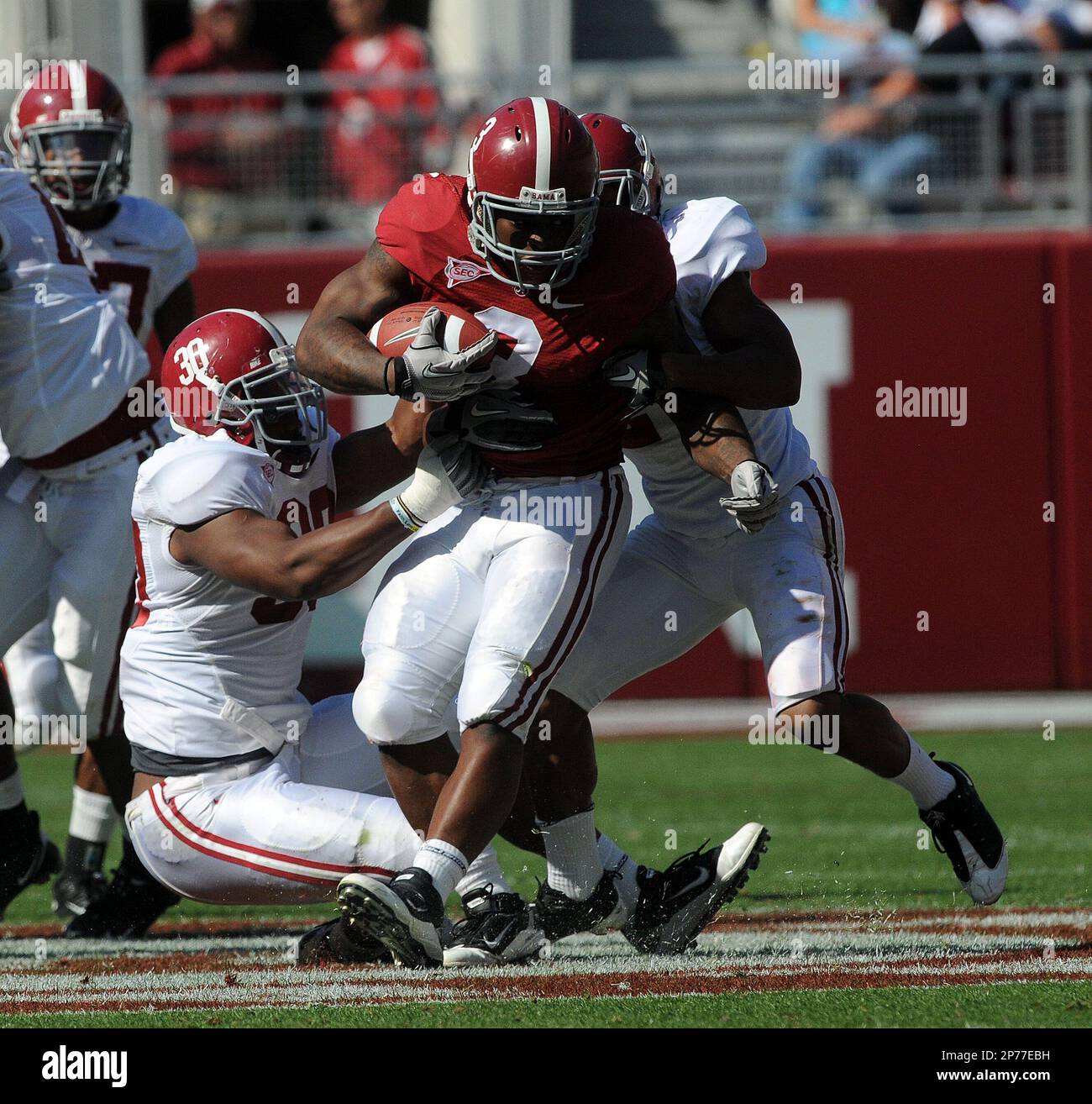 Crimson team running back Trent Richardson (3) attempts to break the ...