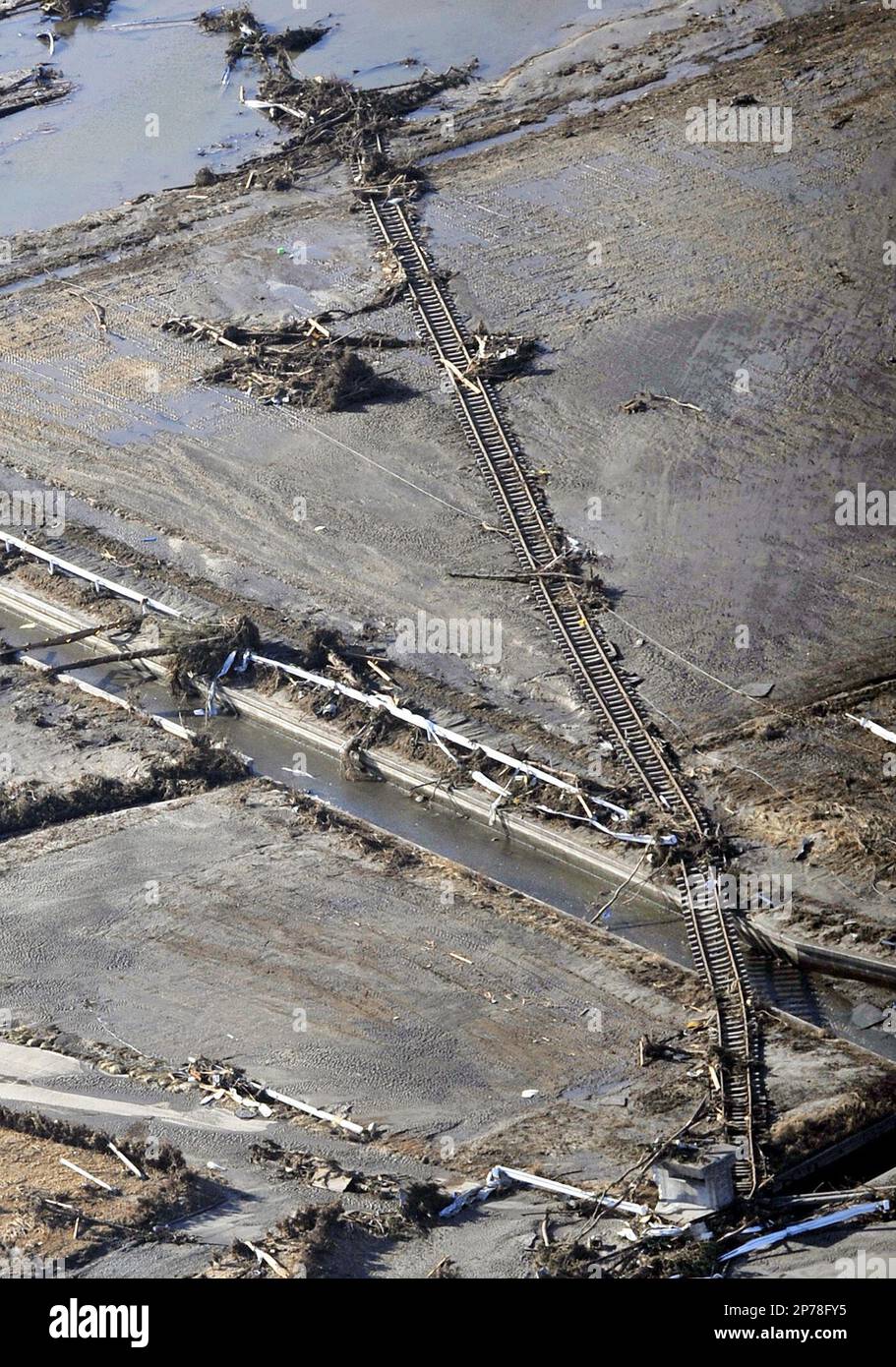 A railway track is swept out by a powerful earthquake-triggered tsunami ...