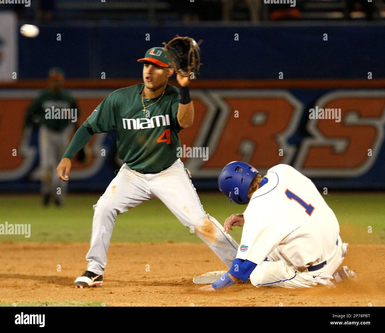 Florida's Bryson Smith (1) slides safely into second base under the tag ...