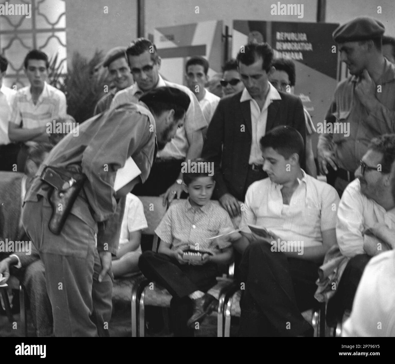 Cuban revolutionary hero Ernesto "Che" Guevara, left, bends towards a ...