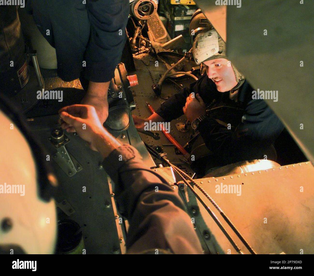 Aviation machinist's mate, second class Michael Padro, right, replaces ...