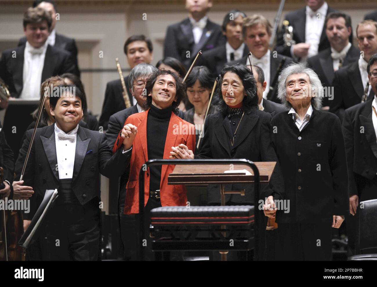 Legendary Japanese conductor Seiji Ozawa, 75, receives a standing ...
