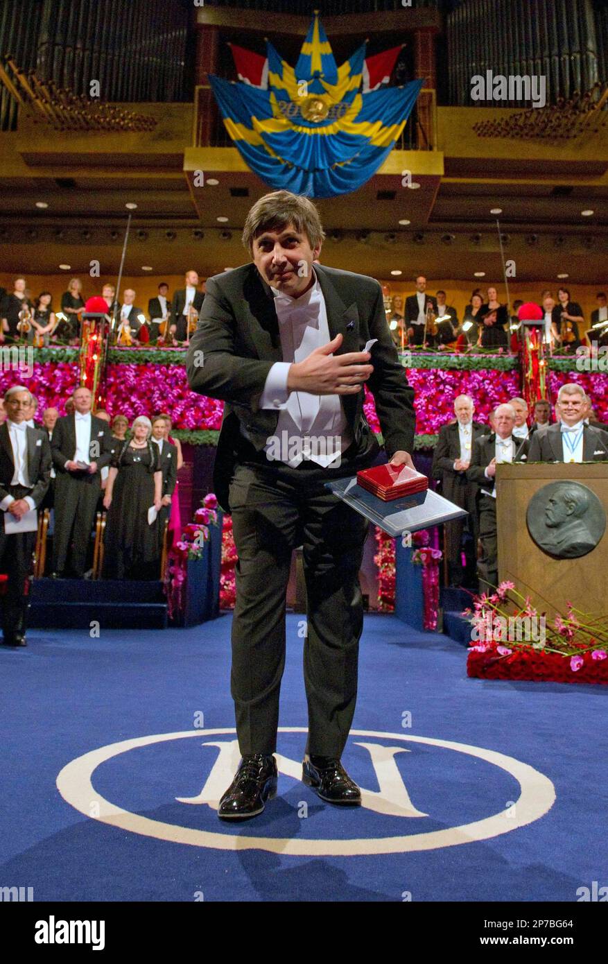 Andre Geim, bows after receiving the Nobel Prize in Physics from ...