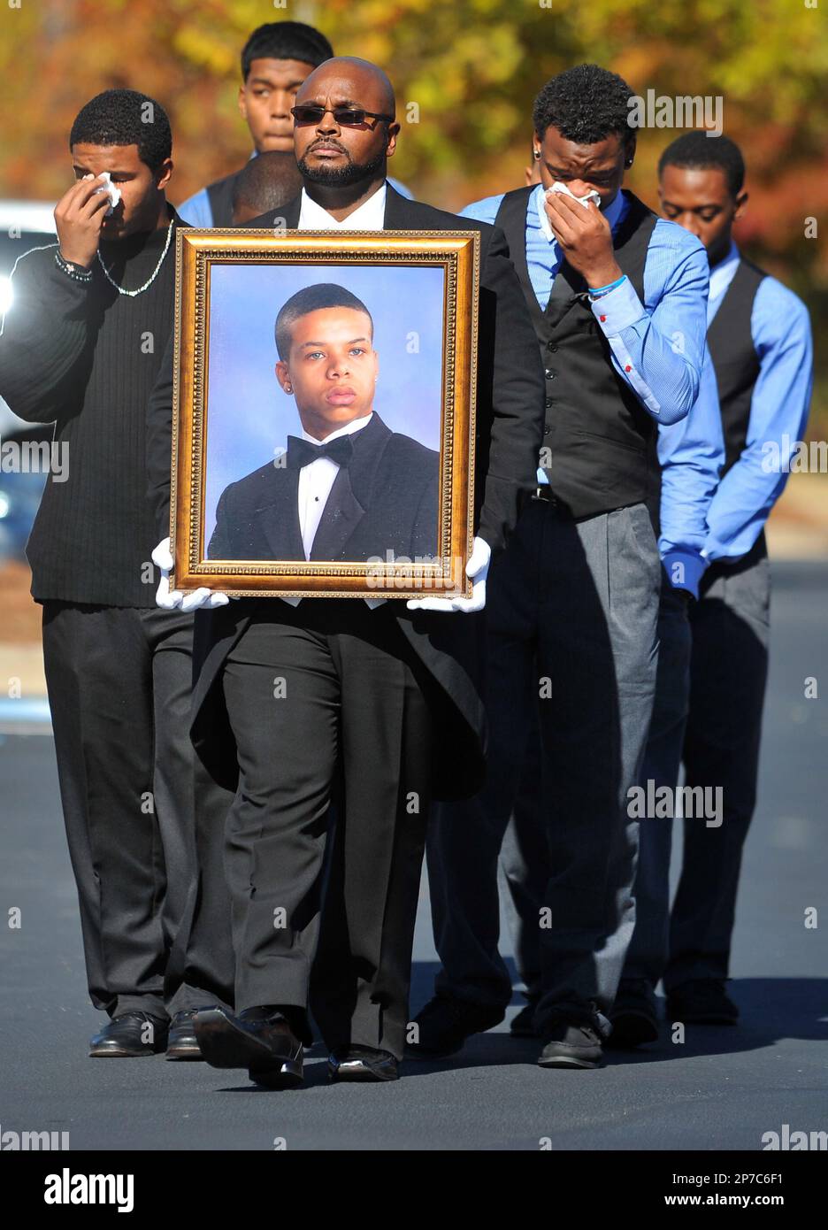 A portrait of Bobby Tillman is carried out of the Siloam Church ...