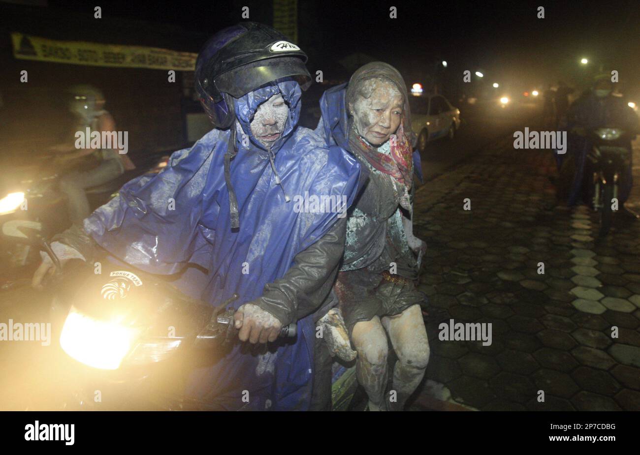 Villager flee their home ride motorcycles following another eruption ...