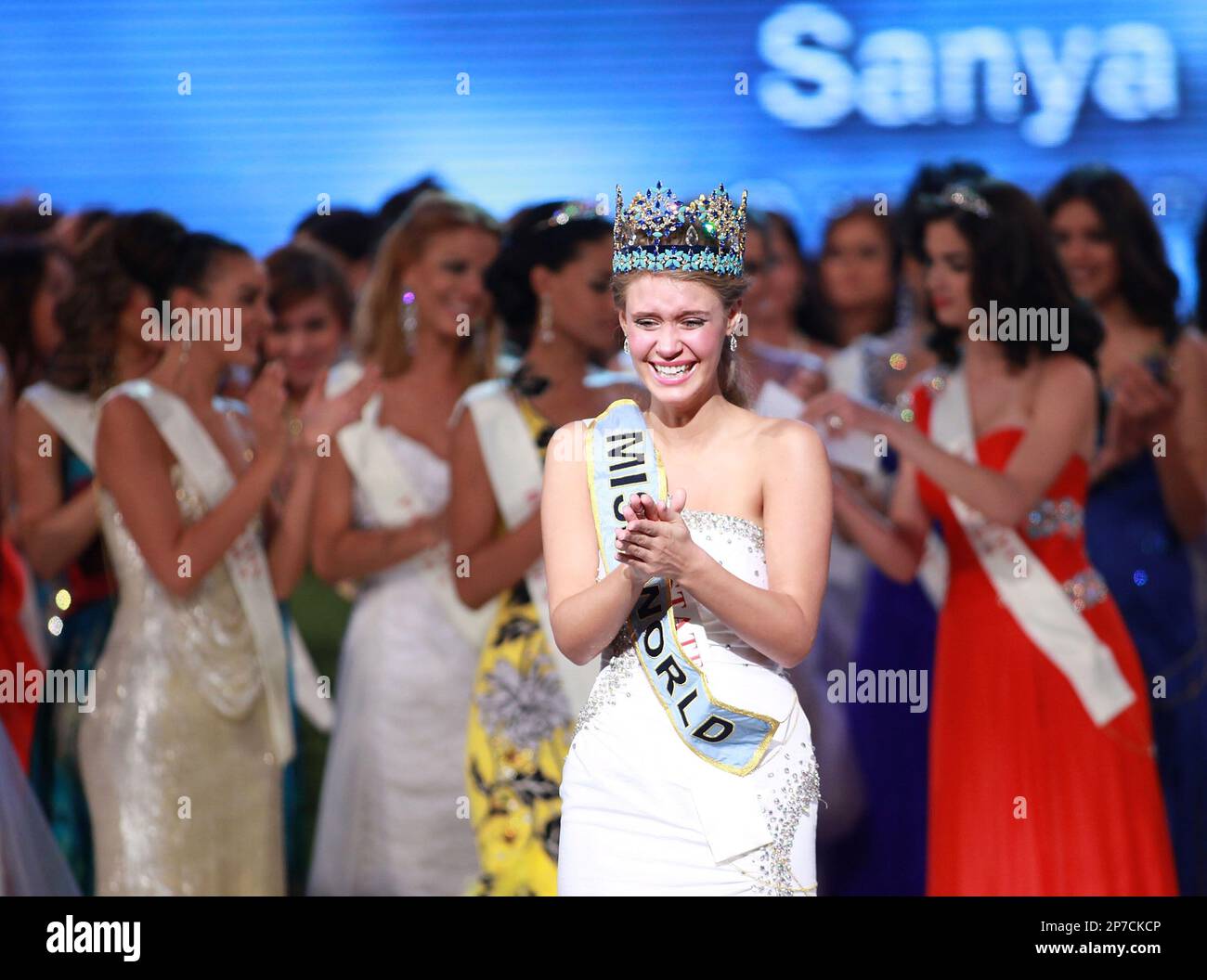 Miss USA Alexandria Mills, front center, gestures with other ...