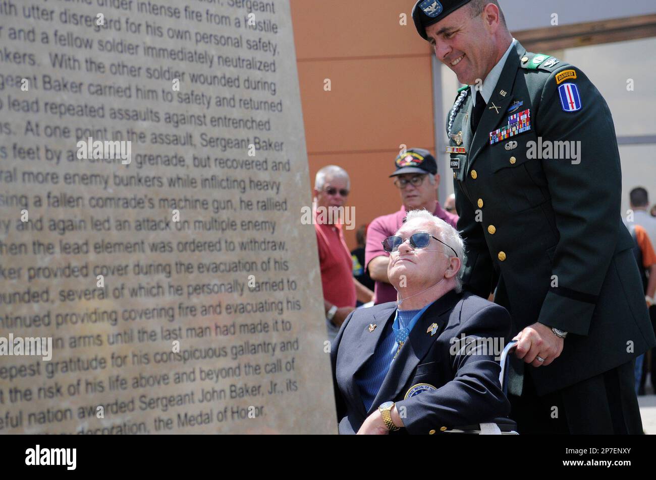 John F. Baker Jr. looks at the new Vietnam War Monument with Colonel ...