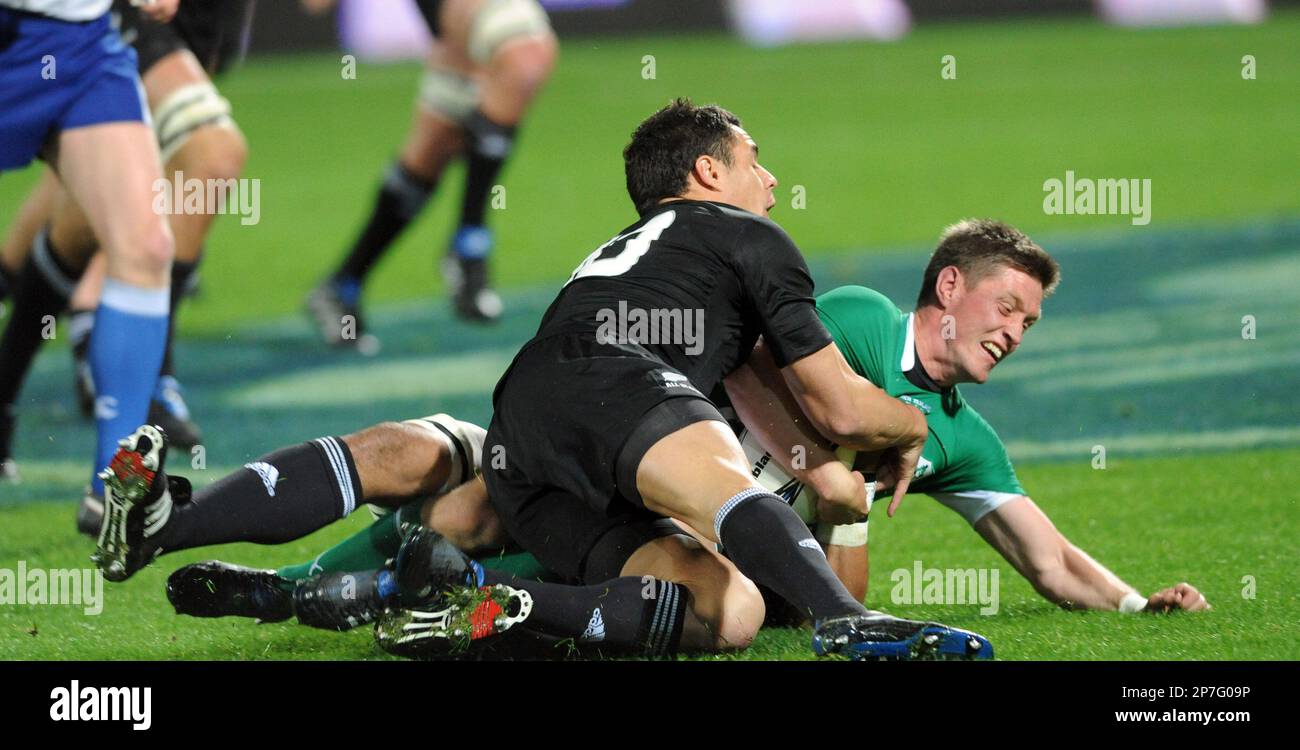 Ireland's Ronan O'Gara is tackled by New Zealand's Dan Carter in an ...