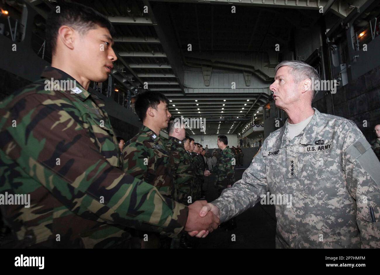 Gen. Walter Sharp, top U.S. military commander in South Korea, right ...