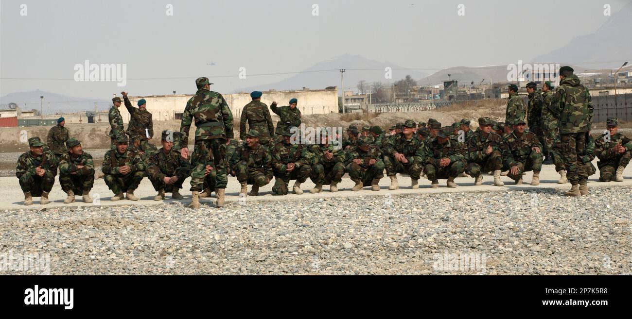 Afghan soldiers rest during basic military training by Turkish officers ...