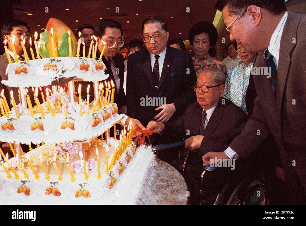 Retail store tycoon Mr C K Tang (seated) celebrates his 90th birthday ...