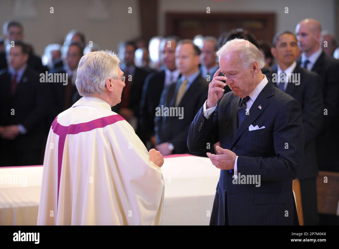Vice President Joe Biden make the sign of the cross during the funeral ...