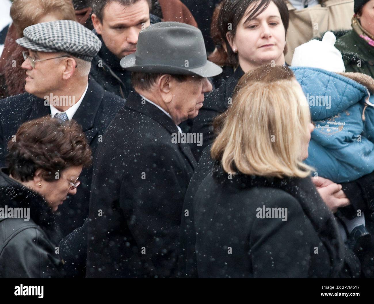 Nicolo Rizzuto Sr. leaves a church following funeral services for his ...