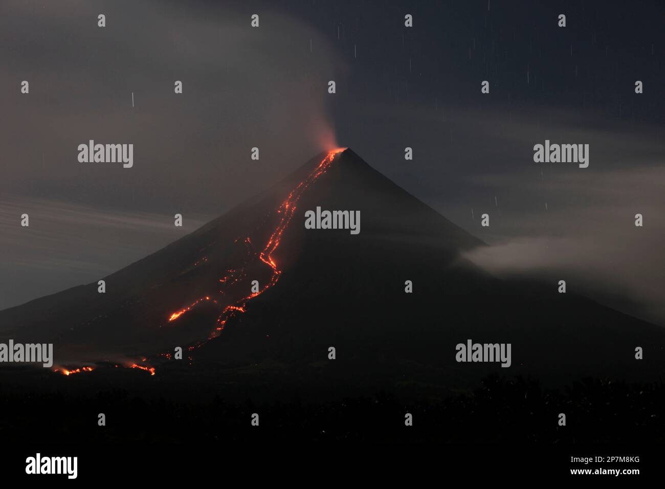 Lava continues to flow from the crater of the restive Mayon volcano in ...