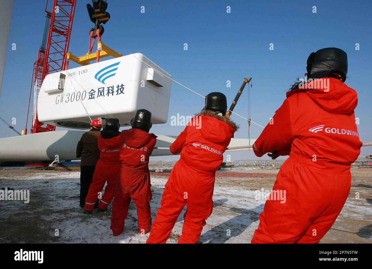 Workers of the Xinjiang Goldwind Science and Technology Co. Ltd ...